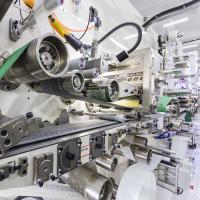 China Full Servo High Speed Sanitary Pad Making Machine 800-1200 PPM PLC Control for sale