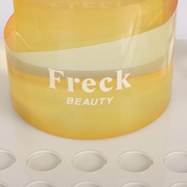 Custom makeup cosmetic display stand in white acrylic with multiple product shelves