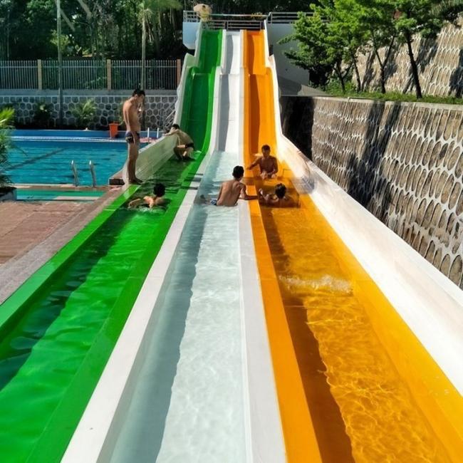 Colorful racing water slide for adults in amusement park