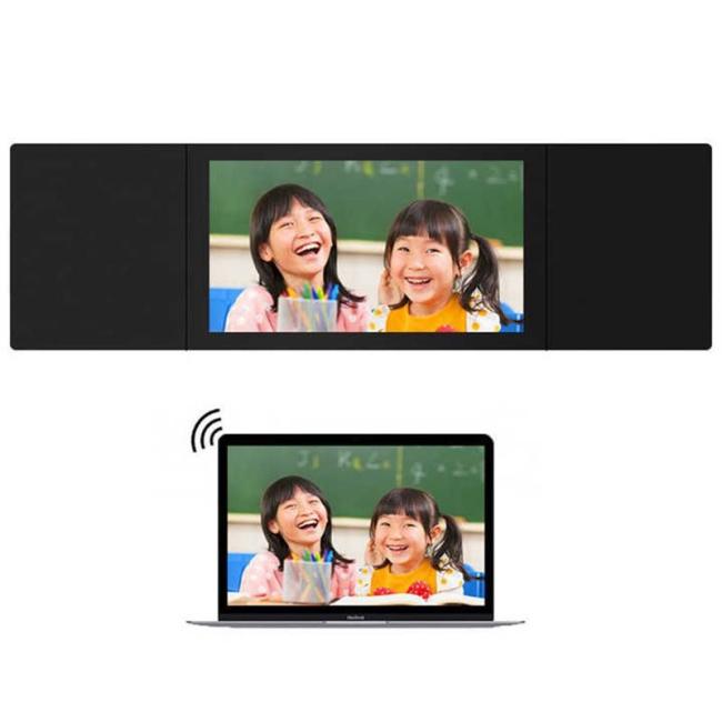 A smart board paired with a small tablet below mirroring a picture of smiling children