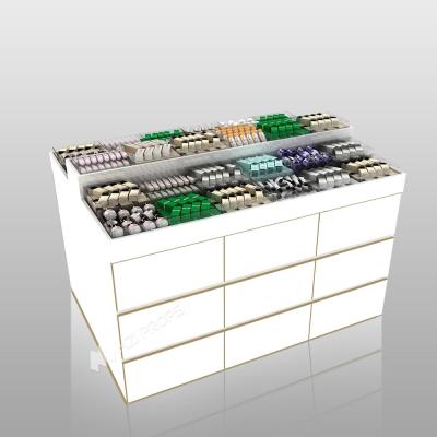 China Skincare Display Fixtures White Wooden Sample With Island Embedded Light Strip For Branding Shop Stand And Premium Store Interior Design for sale