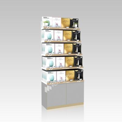China Cosmetic Retail Store Display Shelf  Gray Wooden Facial Mask Back Cabinet For Trendy Shop Furniture And Beauty Store Interior Design for sale