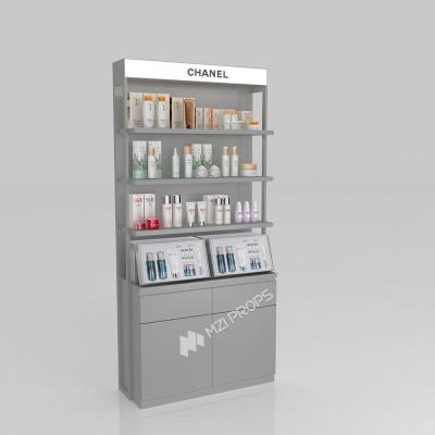 中国 美容院のインテリアデザイン、グレーの木製カウンター、ファッショナブルでシンプル、ブランドストアの備品と高級ストアの装飾用のライトボックス付き 販売のため