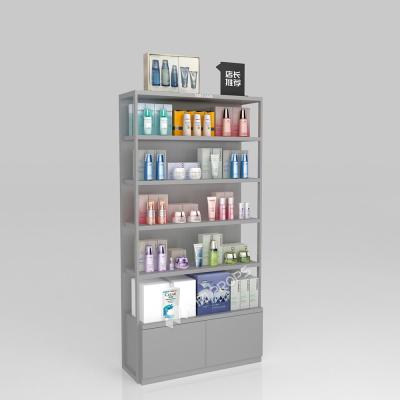 中国 化粧品店のインテリアデザイン グレーの木製カウンター ファッション志向のディスプレイテーブルと高級ショップキャビネット 販売のため