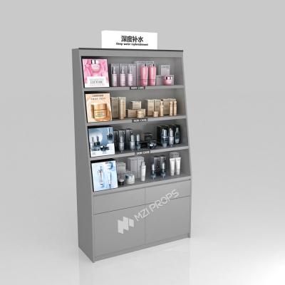 Chine Comptoir en bois gris pour présentoir de soins de la peau, tendance et simple pour les présentoirs de magasins de luxe et les étagères de magasins haut de gamme à vendre