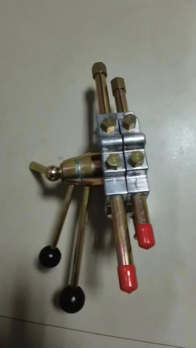 Control system of concrete mixer truck showing dual control levers and hydraulic components