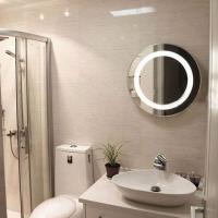 China WiFi Android System Modern Oval LED Makeup Mirror with Touch Screen and Digital Clock for sale