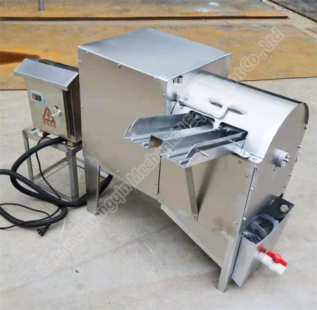 Close-up of egg washing machine operation