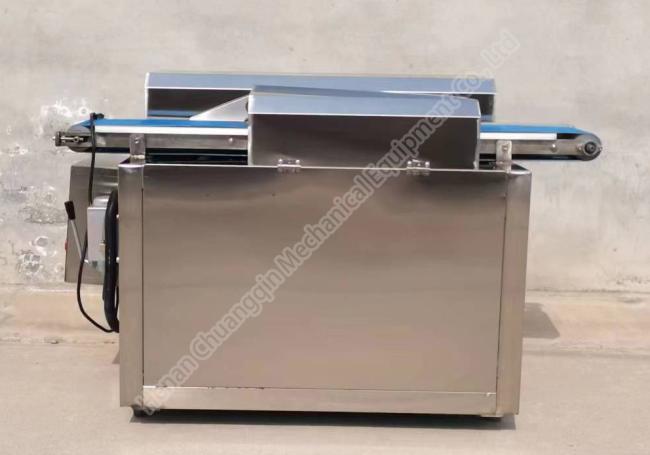 Side view of meat processing equipment