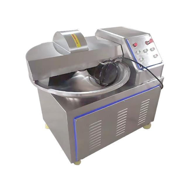 Close-up view of meat processing in bowl cutter