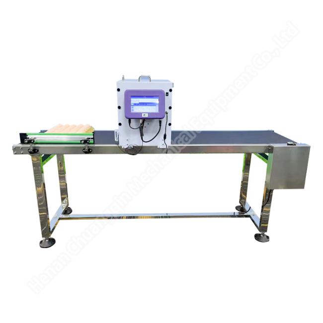 Automatic egg printing machine in operation