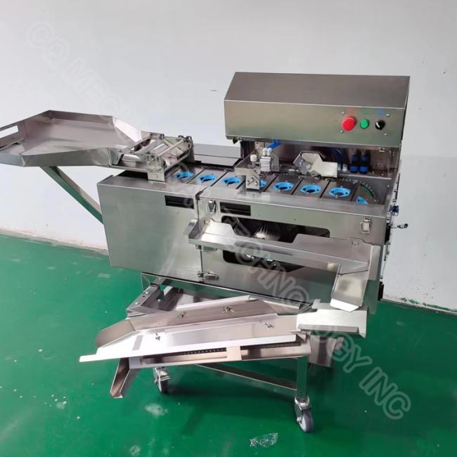 Industrial egg breaking and separating machine in operation