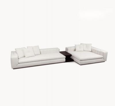 China Cream L Shaped Sofa with Solid Wood Edges Boucle Fabric Hotel Furniture for sale
