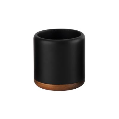 Cina Dispenser di sapone a poliresina di forma rotonda nero con copertura in legno di acacia in vendita