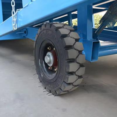 China Heavy-Duty Mobile Loading Ramp with Solid Tyres for Maximum Safety and Durability for sale