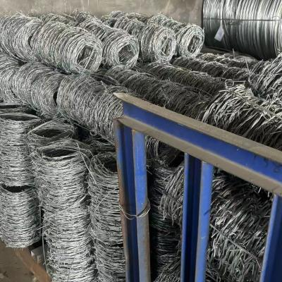 China Military Stronghold PVC Concertina Coil Wire Barbed Spiral Razor Wire for sale