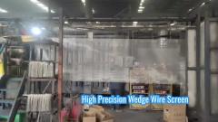 Stainless steel woven mesh is being produced in the factory workshop.