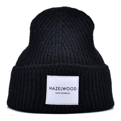 China Custom Embroidery / Printed Logo Acrylic Beanies Jacquard Knitted Hats Warm Hat With Patch for sale