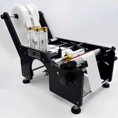 China Manual hand easy bottle label dispenser single bar bottle labeling machine for sale