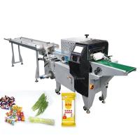 China 400KG Weight Multi-Function Chocolate Foil and Paper Wrapping Machine with Conveyor for sale