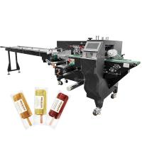China 400KG Weight Multi-Function Chocolate Foil and Paper Wrapping Machine with Conveyor for sale