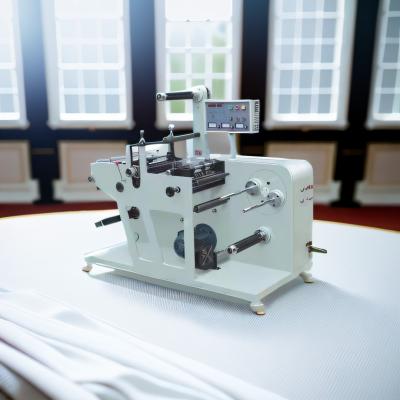 Китай МАШИНА ПЛАШКИ CUTING ЯРЛЫКА MQ320-Y РОТОРНАЯ ПУСТАЯ С SLITTER РАЗМАТЫВАЯ И ВНИЗ ПЕРЕМАТЫВАТЬ ДИАМЕТРОМ НА 700MM С ТОРМОЗОМ 5KG продается