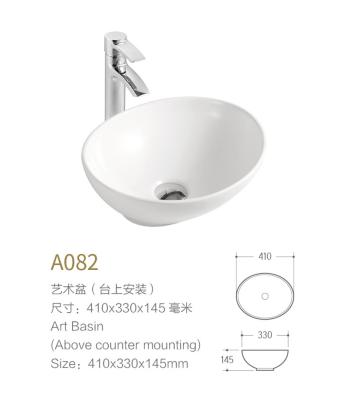 Cina Lavabo minimo dell'avorio di colore della nave del bagno del lavandino ovale bianco creativo della porcellana in vendita