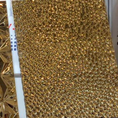 China Premium 304 titanium gold water wave steel panel for luxury decoration. for sale