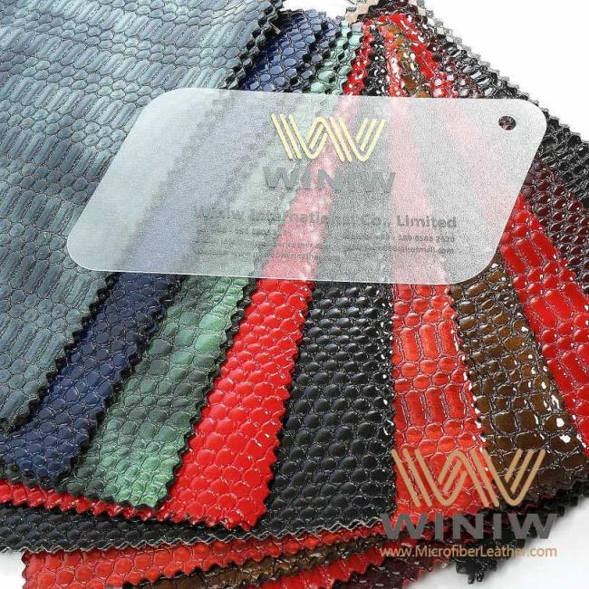 l'unità di elaborazione del Faux di punto culminante di spessore di 1.2mm riveste di pelle con la schiuma del vegano delle borse impressa struttura del coccodrillo