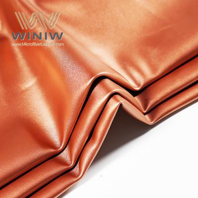 中国 1.4mm Orange Micro Fiber PU Vegan Leather Bags Making Leather Fabric Material 販売のため