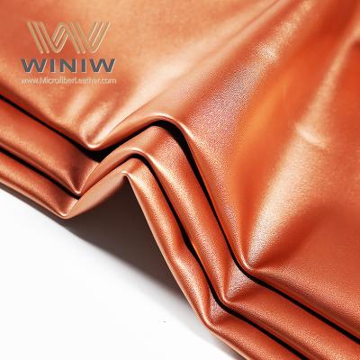 中国 1.4mm Orange Micro Fiber PU Vegan Leather Bags Making Leather Fabric Material 販売のため