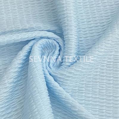 Китай Upf повторно использовало простирание ткани Swimwear текстурировало носку пляжа бикини дам продается