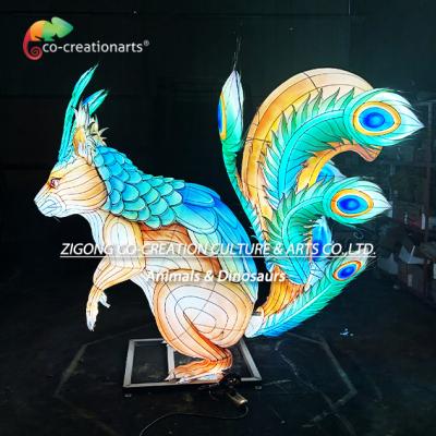 China Giant Illuminated Squirrel Sculpture Lantern With Dazzling Peacock Feather Tail for sale