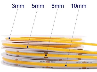 Cina DC 12V 24V 5V Ultra Narrow 3mm Dotless COB LED Strip Light per illuminazione flessibile in vendita