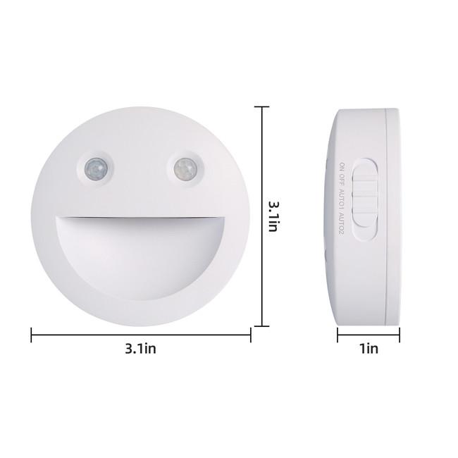 Smiling face LED night light showing warm illumination