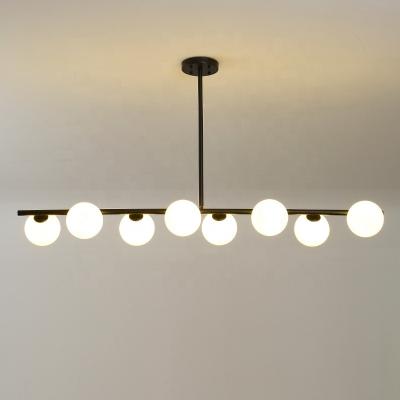 China Black Gold Metal dining room chandelier modern simple style clear glass ball lights Nordic pendant lamps for sale
