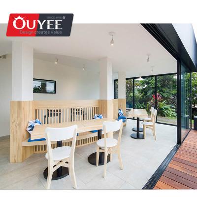 Cina Modern Interior Designed Wooden Shop Milk Tea Shop Floor Standing Cabinet With Table Chairs in vendita