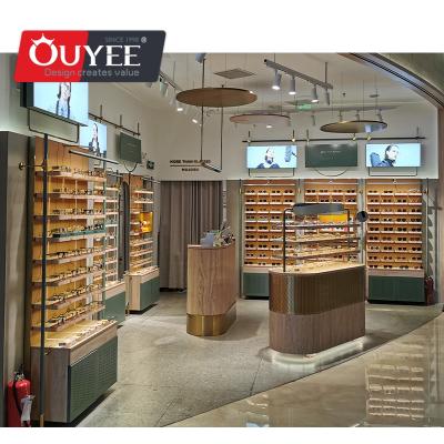 中国 Latest Popular Optical Store Optical Shop Interior Designed Wooden Customized Glasses Showcases Cabinet Showcase 販売のため