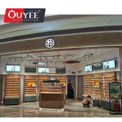 中国 Modern Optical Retail Shop Store Interior Decoration Designs With Customized Sunglasses Display Cabinet 販売のため