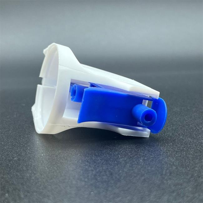 Close-up view of spray nozzle foam button mechanism