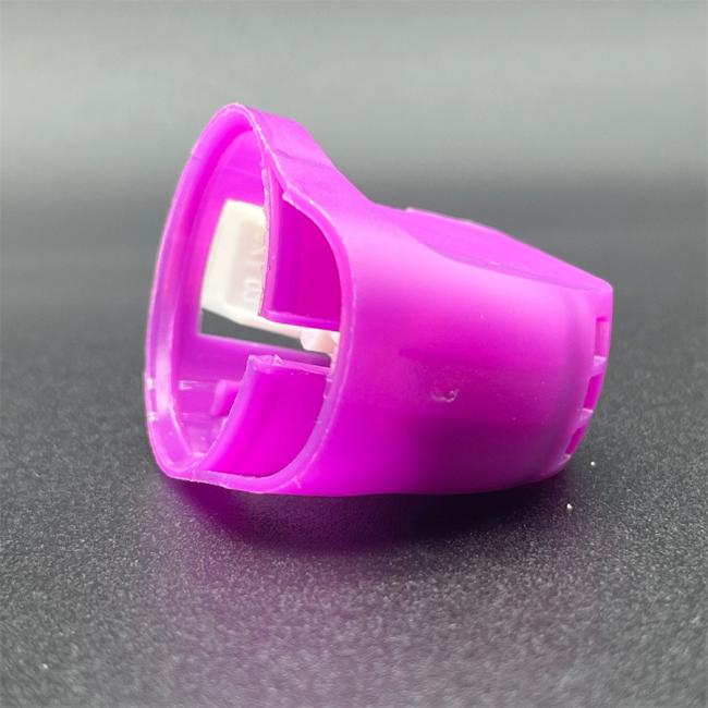 Close-up of spray gun's adjustable nozzle mechanism