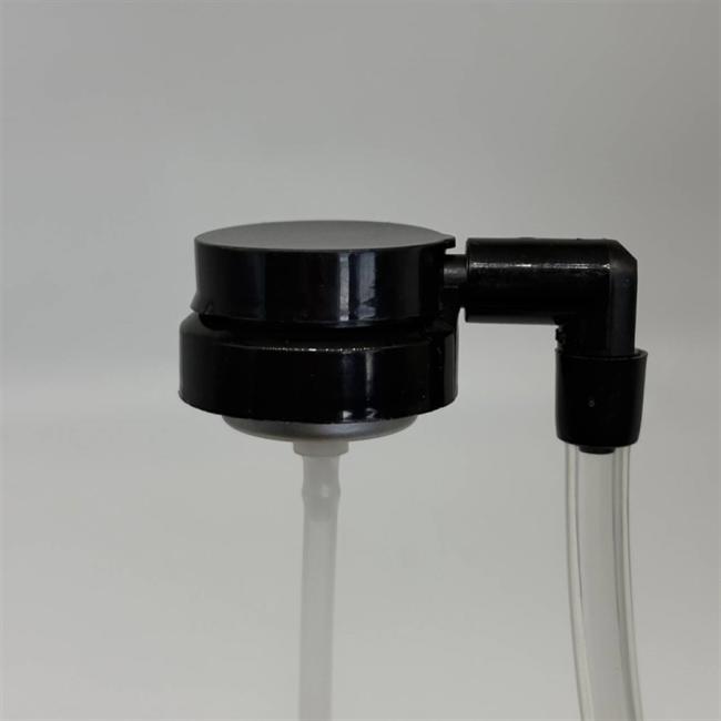 Side view of tire inflation valve with black cap