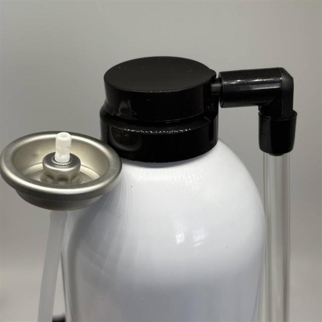 Close-up view of tire inflation valve showing brass construction