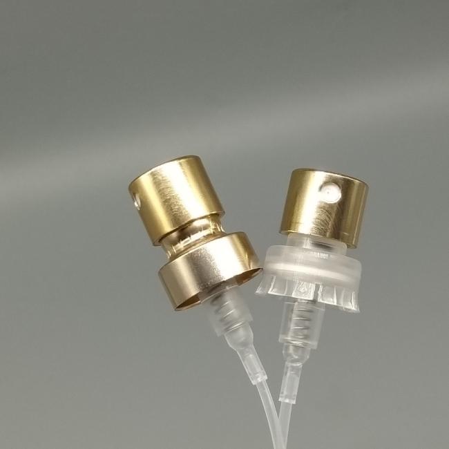 Golden luxury perfume pump dispenser on fragrance bottle