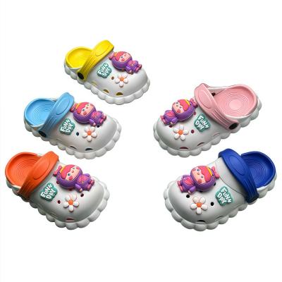 China EVA Kids Cartoon Doll Flower Decorated Clogs Casual Slippers for sale