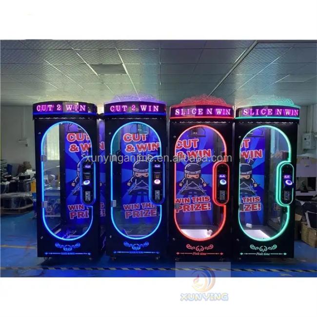 Side view of prize machine showing coin mechanism and prize compartments