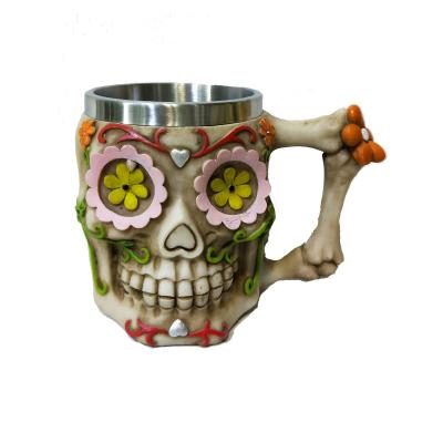 China 400ml Skull head polyresin double side stainless steel mug for sale