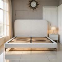 China Sophisticated Textured Upholstered Bed Blends Soft Fabric with Sleek Structural Elements for sale