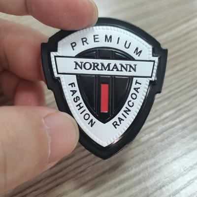 China Custom Design Round Free Design Garment Labels and TPU Badges for Multi-Usage Clothing and Accessories for sale