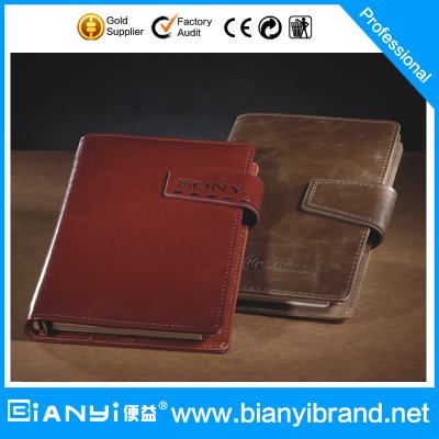 China New design high quality black pvc cover with removable spiral notebook with red pen holder for sale